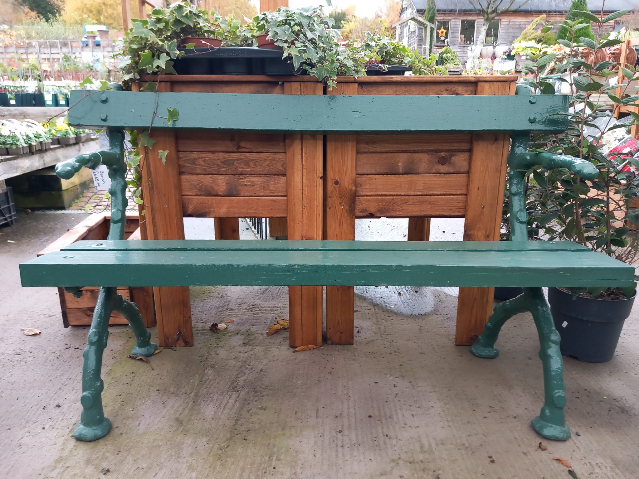 A very attractive green painted vintage timber bench with sturdy cast ...